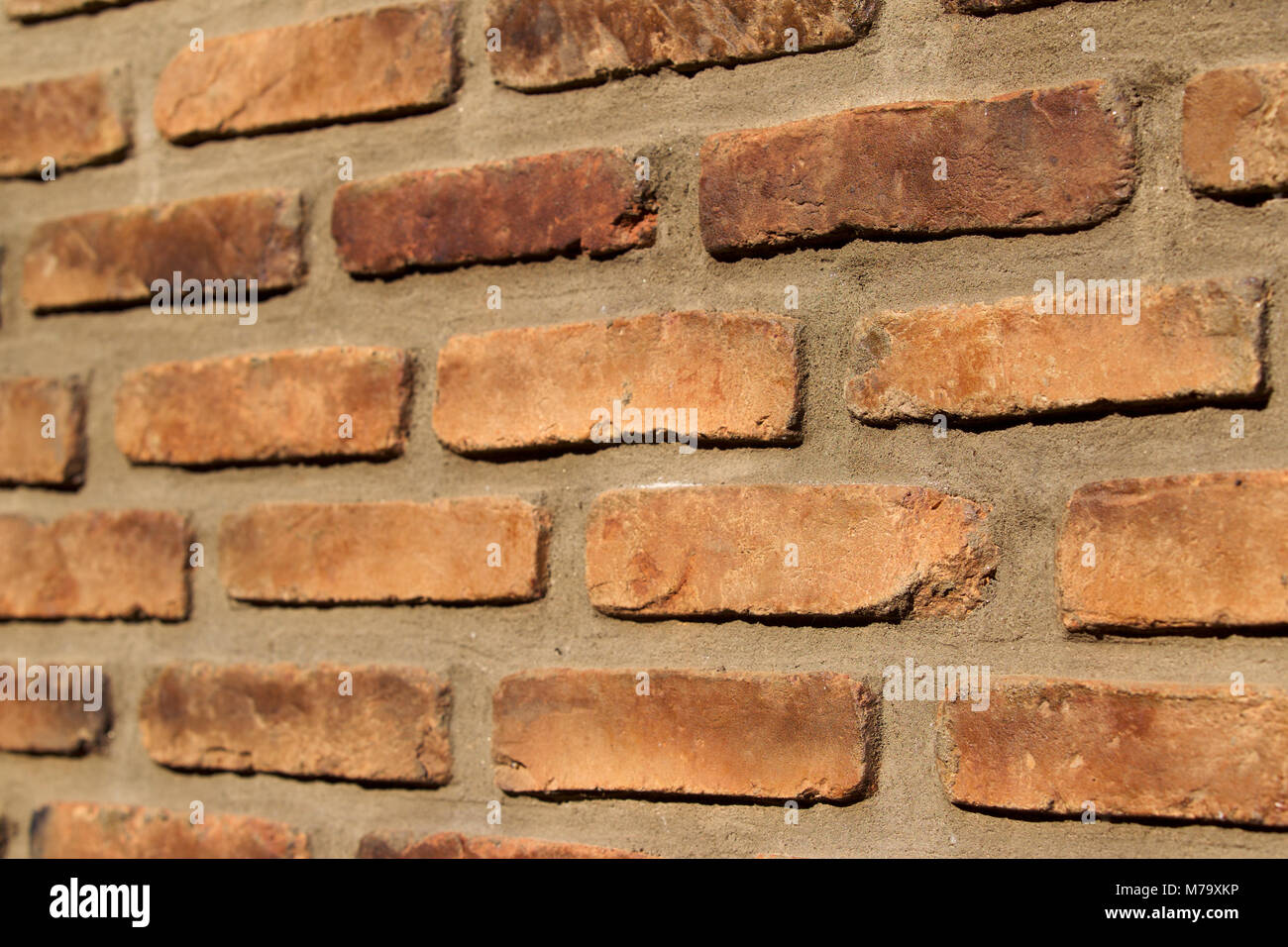 Brick masonry of red brick with a binder solution Stock Photo - Alamy