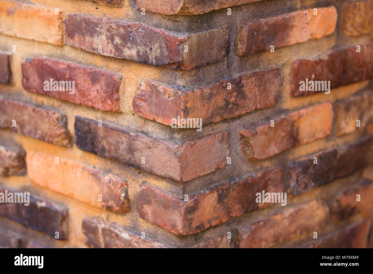Brick masonry of red brick with a binder solution Stock Photo - Alamy