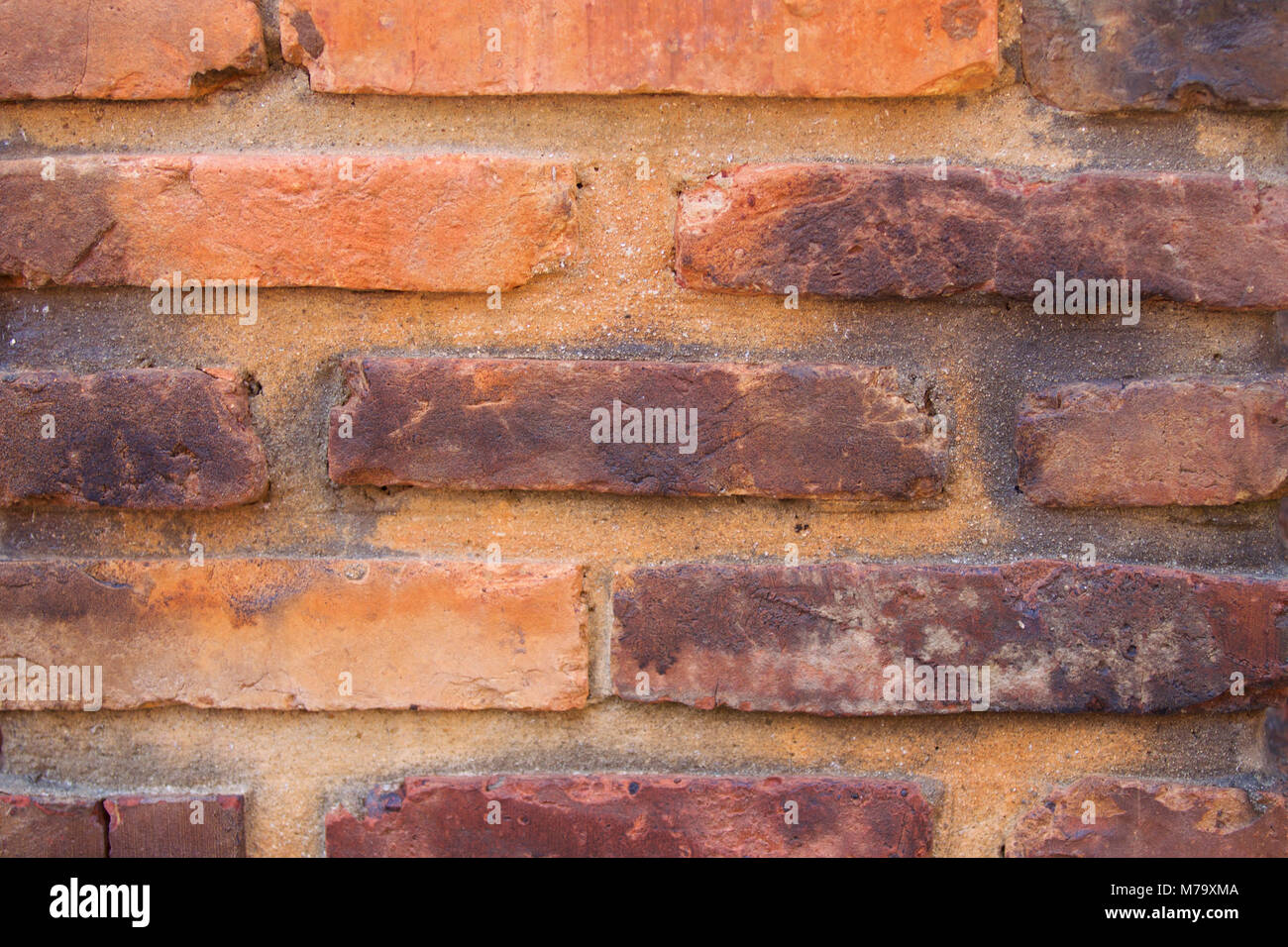 Brick masonry of red brick with a binder solution Stock Photo - Alamy