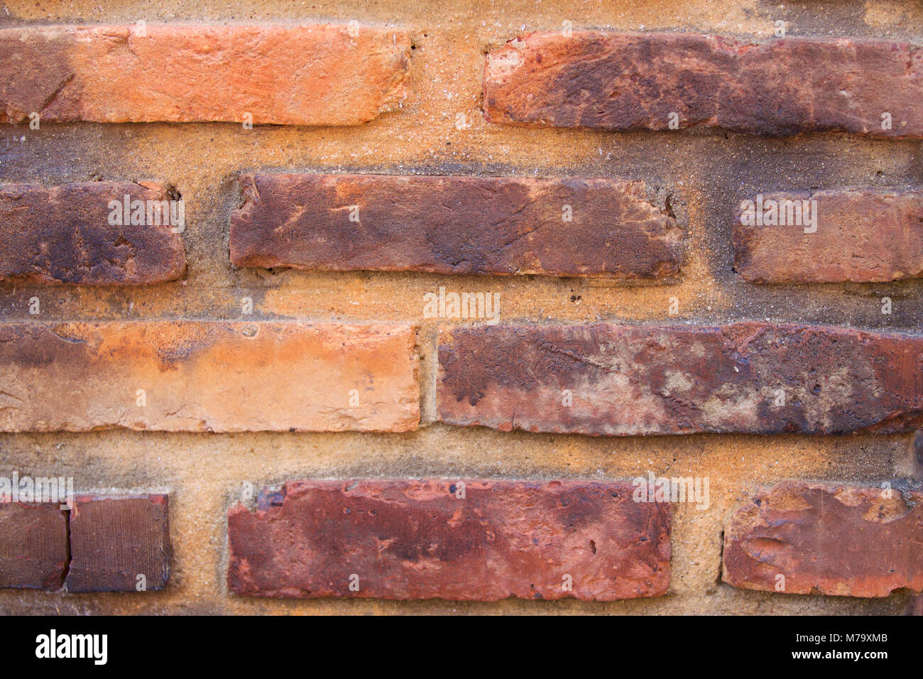 Brick masonry of red brick with a binder solution Stock Photo - Alamy