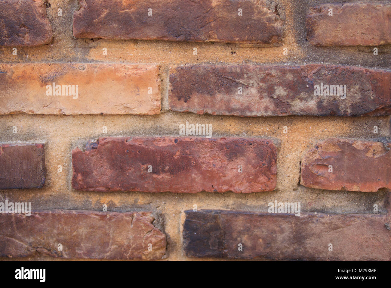 Brick masonry of red brick with a binder solution Stock Photo - Alamy