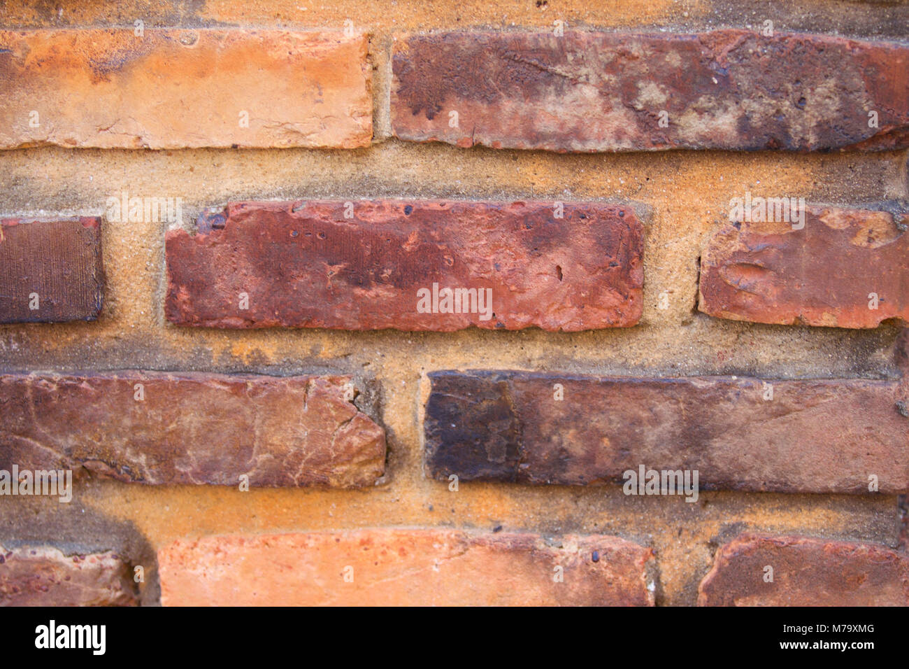 Brick masonry of red brick with a binder solution Stock Photo - Alamy