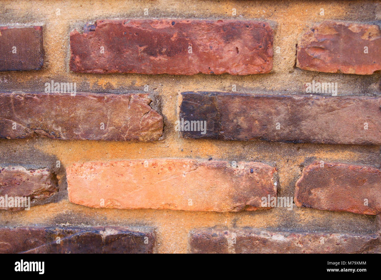 Brick masonry of red brick with a binder solution Stock Photo - Alamy