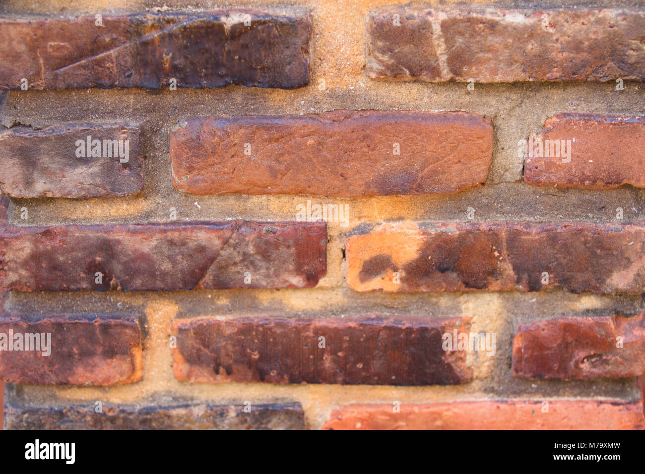 Brick masonry of red brick with a binder solution Stock Photo - Alamy