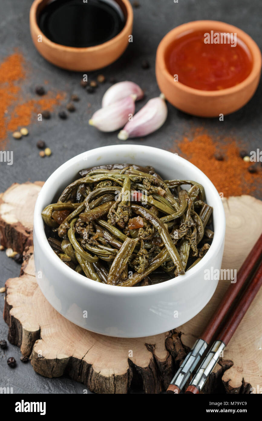 Spicy salad of fern with onion, garlic, soy sauce and spices. Dish ...