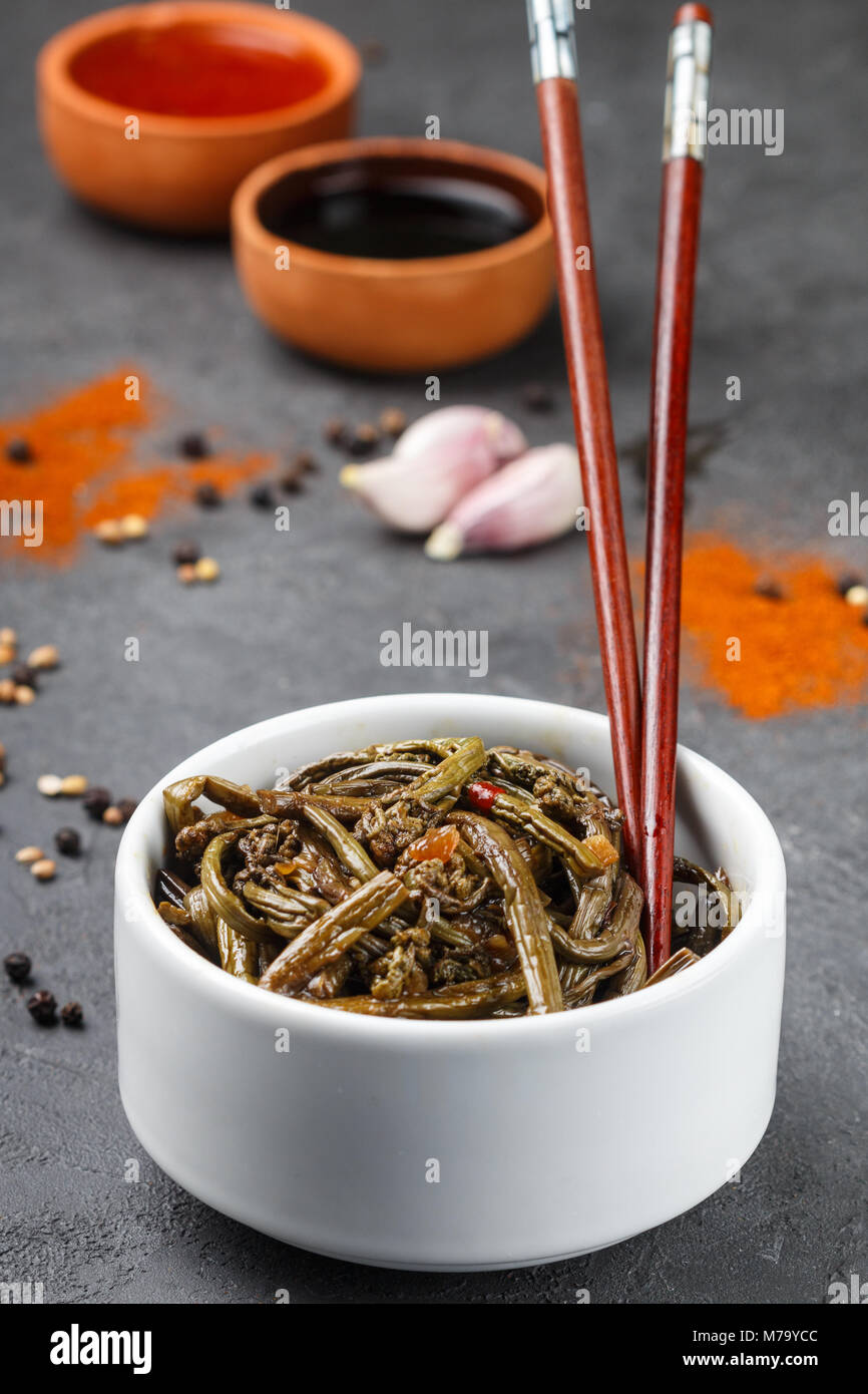 Spicy salad of fern with onion, garlic, soy sauce and spices. Dish ...