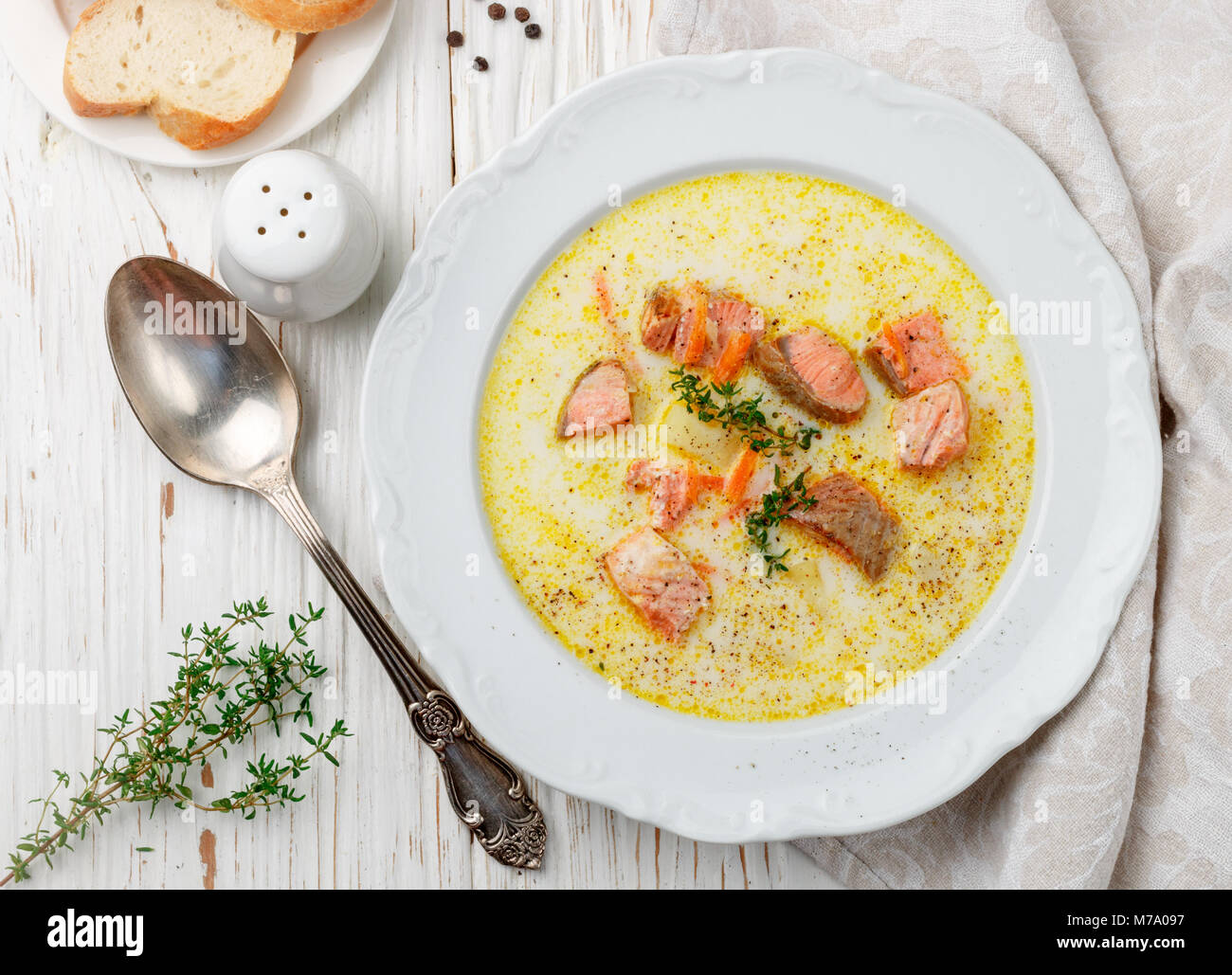 Creamy fish soup with salmon, potatoes, onions and carrots. Kalakeitto ...