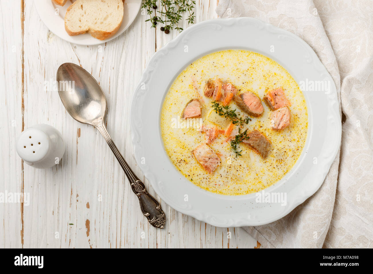Creamy fish soup with salmon, potatoes, onions and carrots. Kalakeitto ...