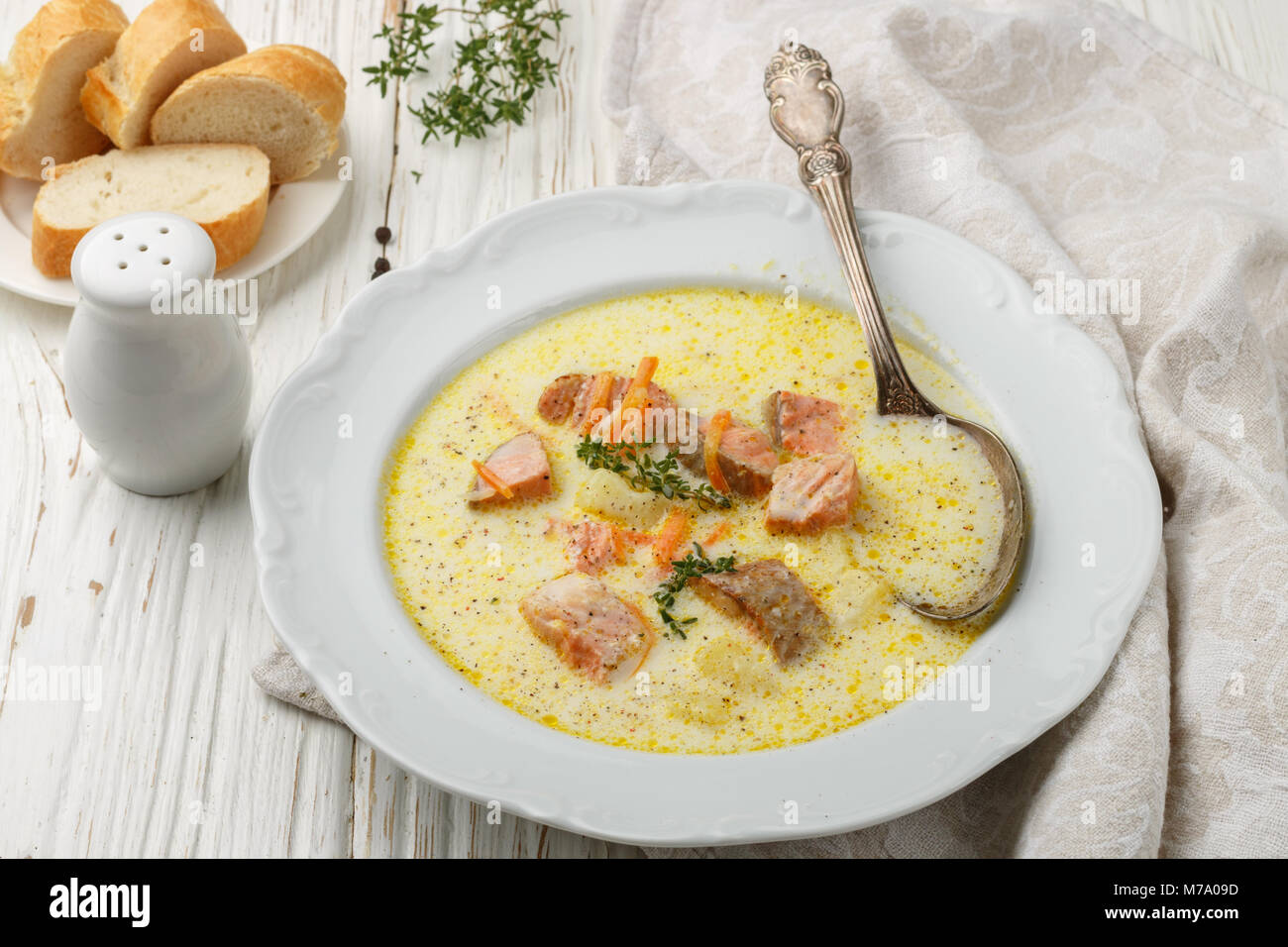 Creamy fish soup with salmon, potatoes, onions and carrots. Kalakeitto ...