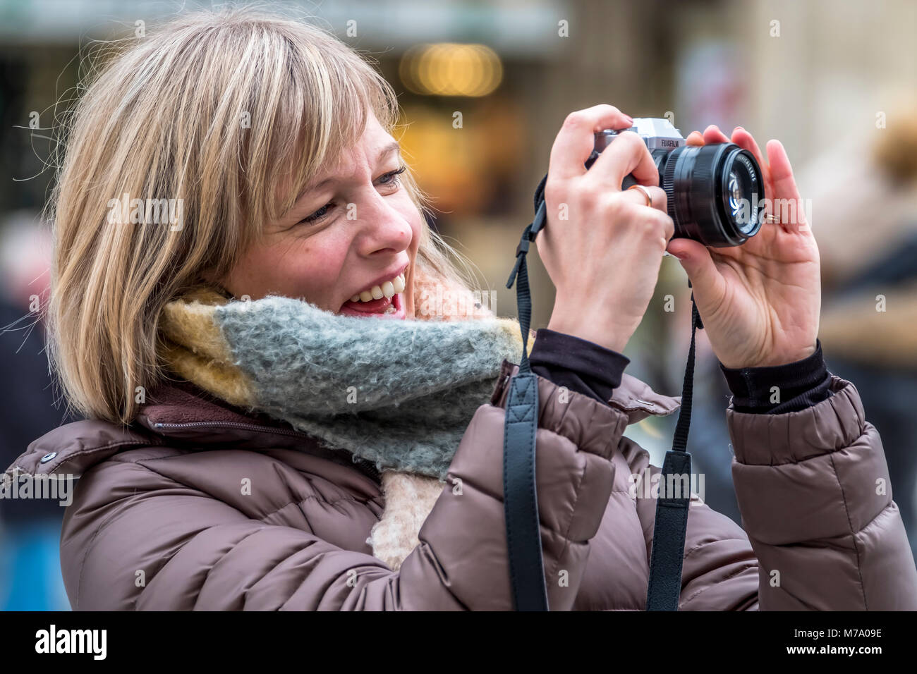 MUNICH / GERMANY - FEBRUARY 15 2018 : Lady photographing her family ...