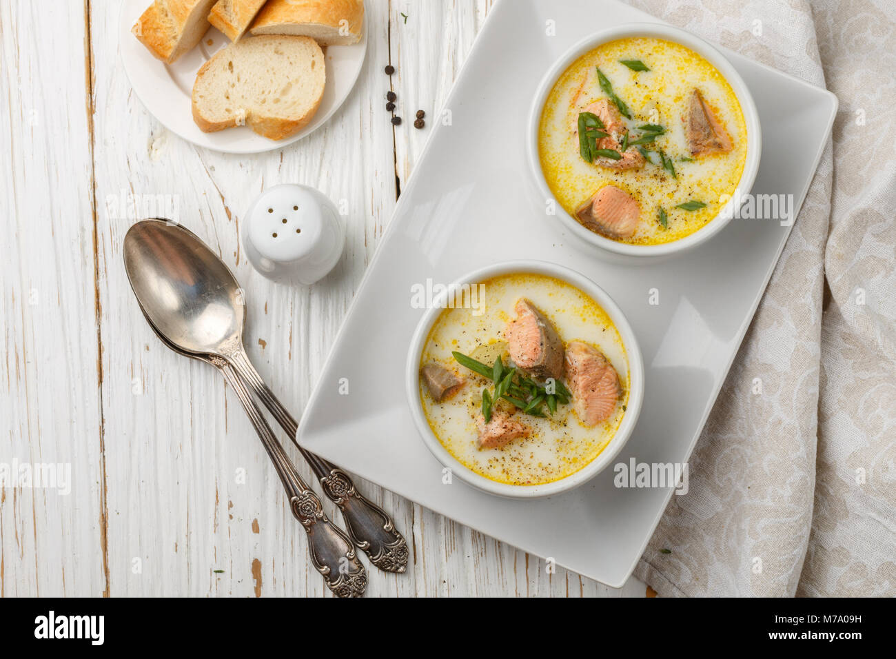 Creamy fish soup with salmon, potatoes, onions and carrots. Kalakeitto ...
