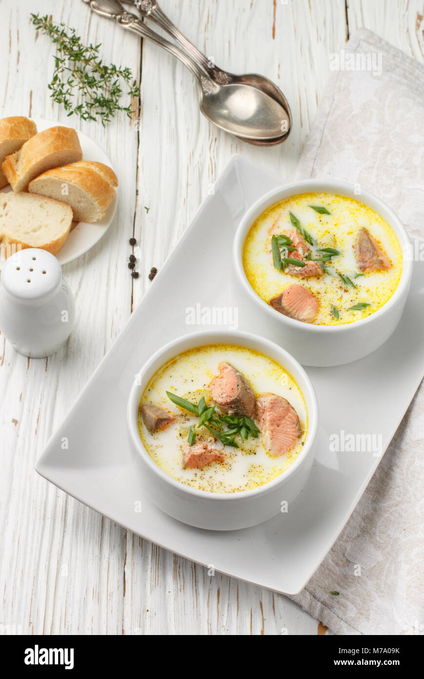 Creamy fish soup with salmon, potatoes, onions and carrots. Kalakeitto ...