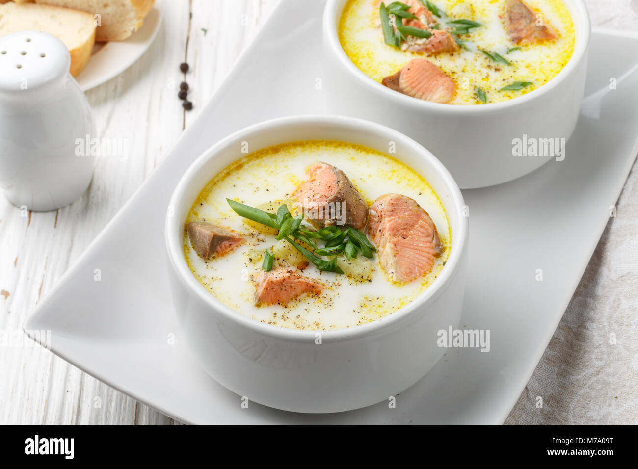 Creamy fish soup with salmon, potatoes, onions and carrots. Kalakeitto ...