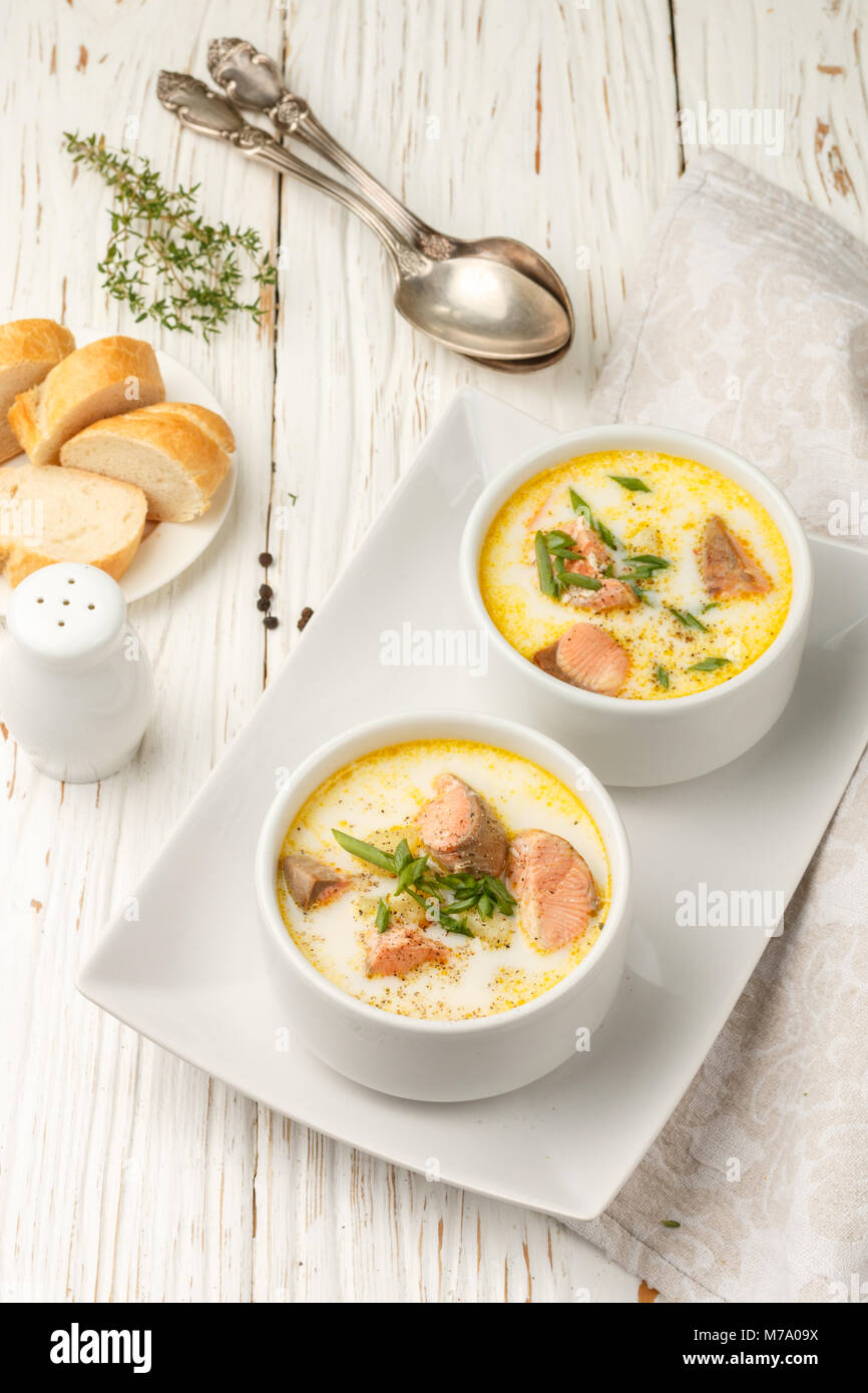 Creamy fish soup with salmon, potatoes, onions and carrots. Kalakeitto ...