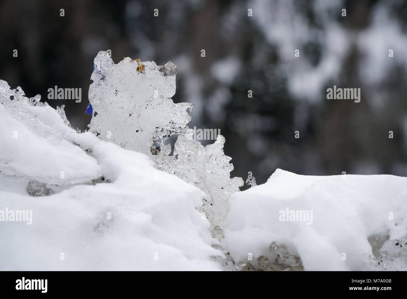 Snow Winter background, close-up of frosted ice lump on a snowing day ...