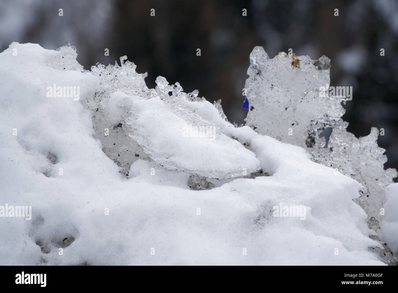 Snow Winter background, close-up of frosted ice lump on a snowing day ...