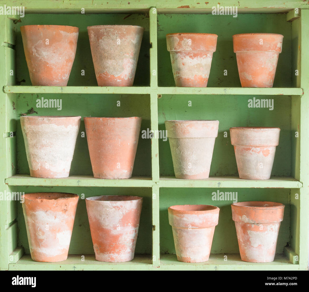 Old flower pots on a shelf Stock Photo - Alamy