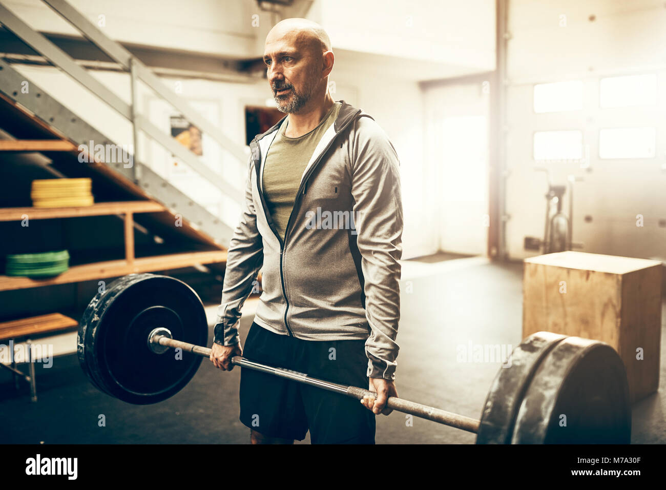 Athlete straining lifting weights hi-res stock photography and images ...