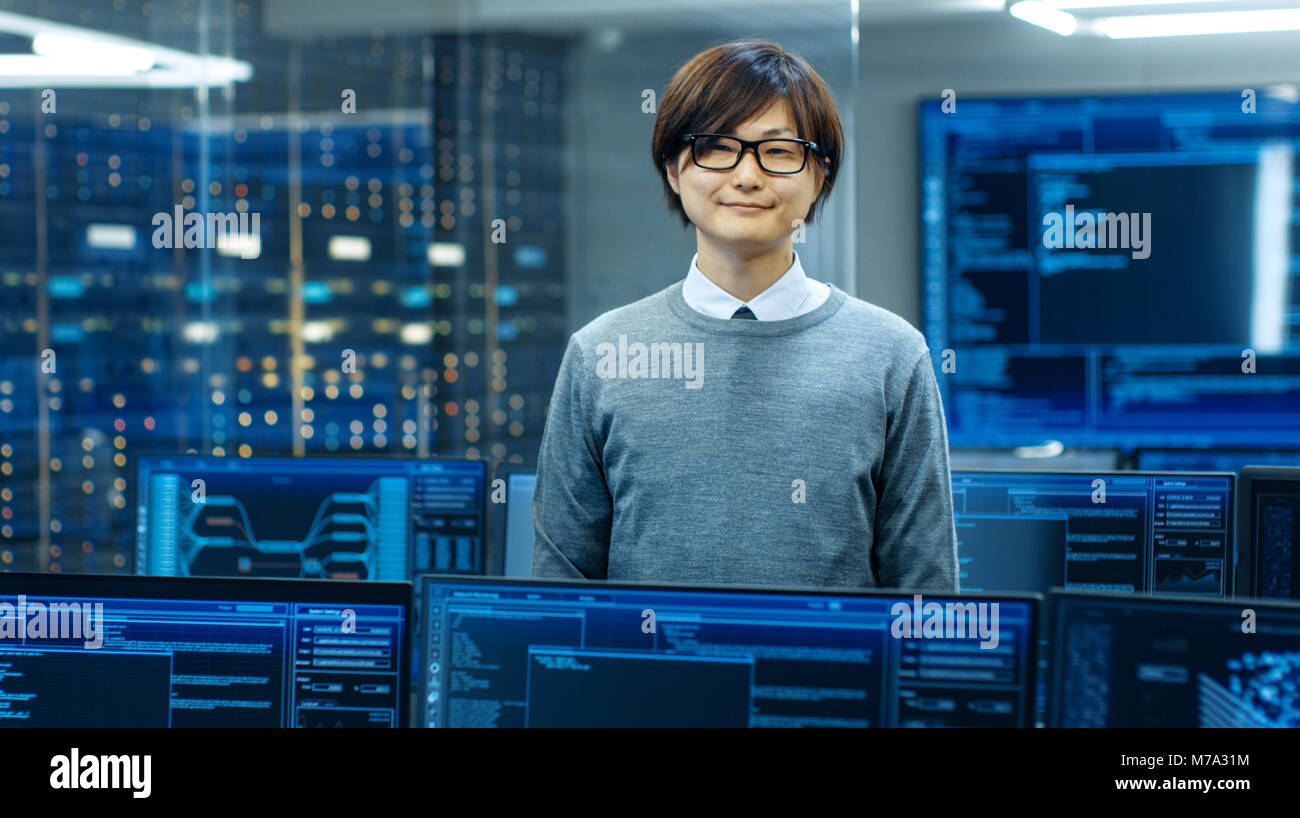 In the System Control Room Technical Operator Stands and Looks at the ...