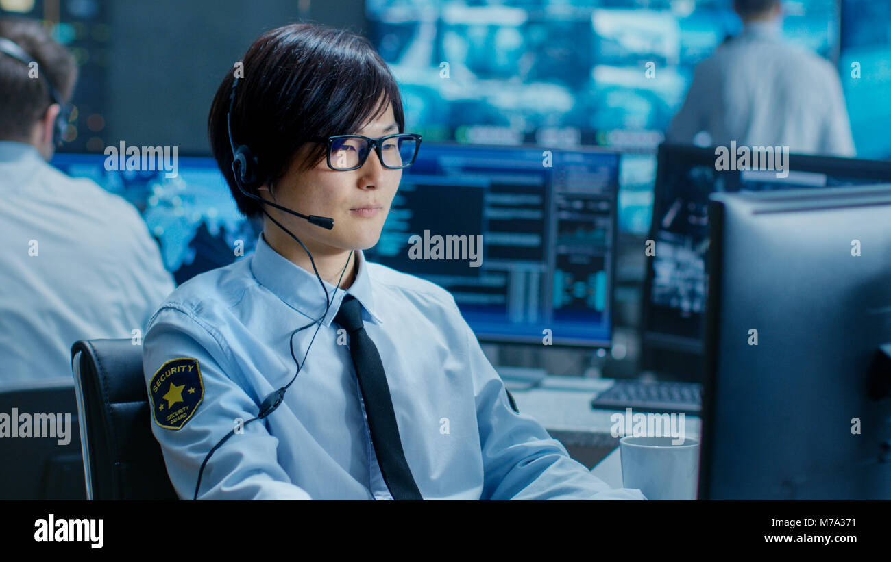 In the Security Command Center Officer at His Workstation Monitors ...