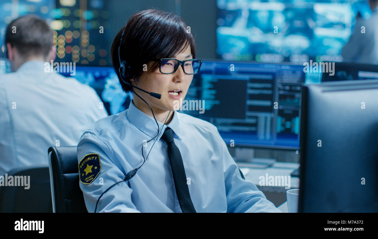 In the Security Command Center Officer at His Workstation Monitors ...