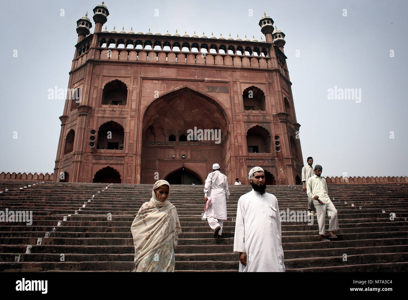 Old Delhi, India: some Muslims descend and climb the stairs of the Jama ...
