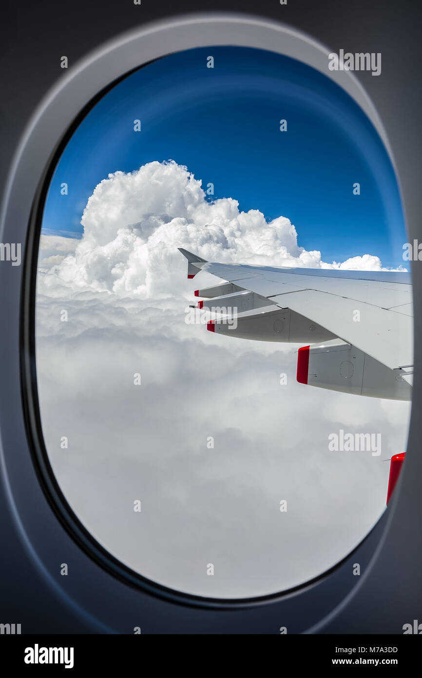 View of an airplane wing out the window Stock Photo - Alamy