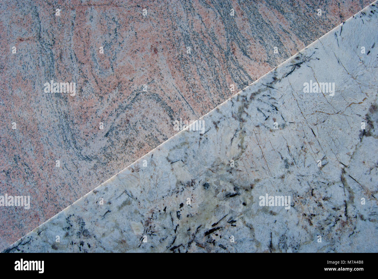 2 different overlapping Carrara marble slabs that draw an oblique line ...