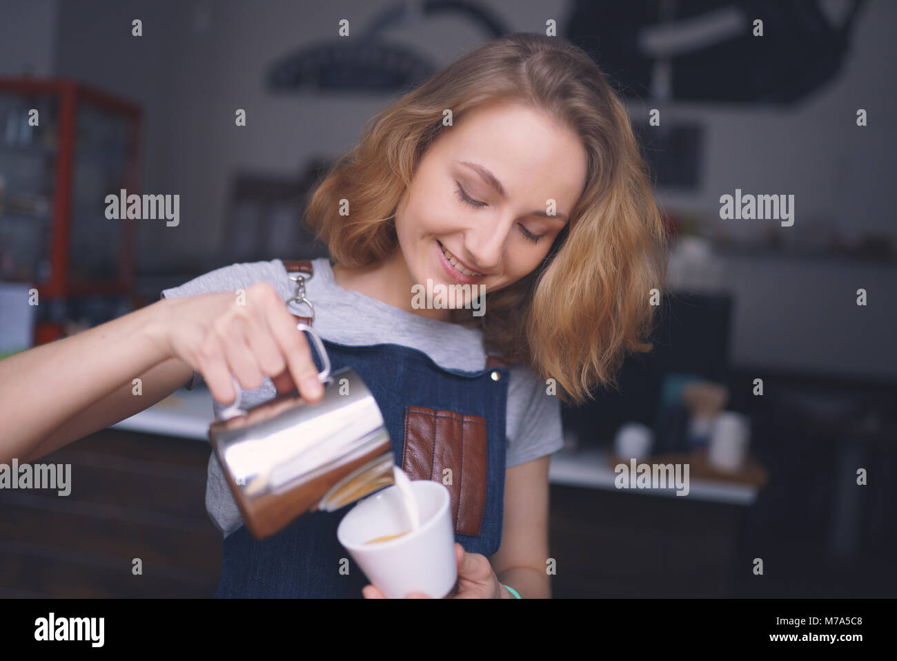 beautiful girl making coffee (cappuccino Stock Photo - Alamy