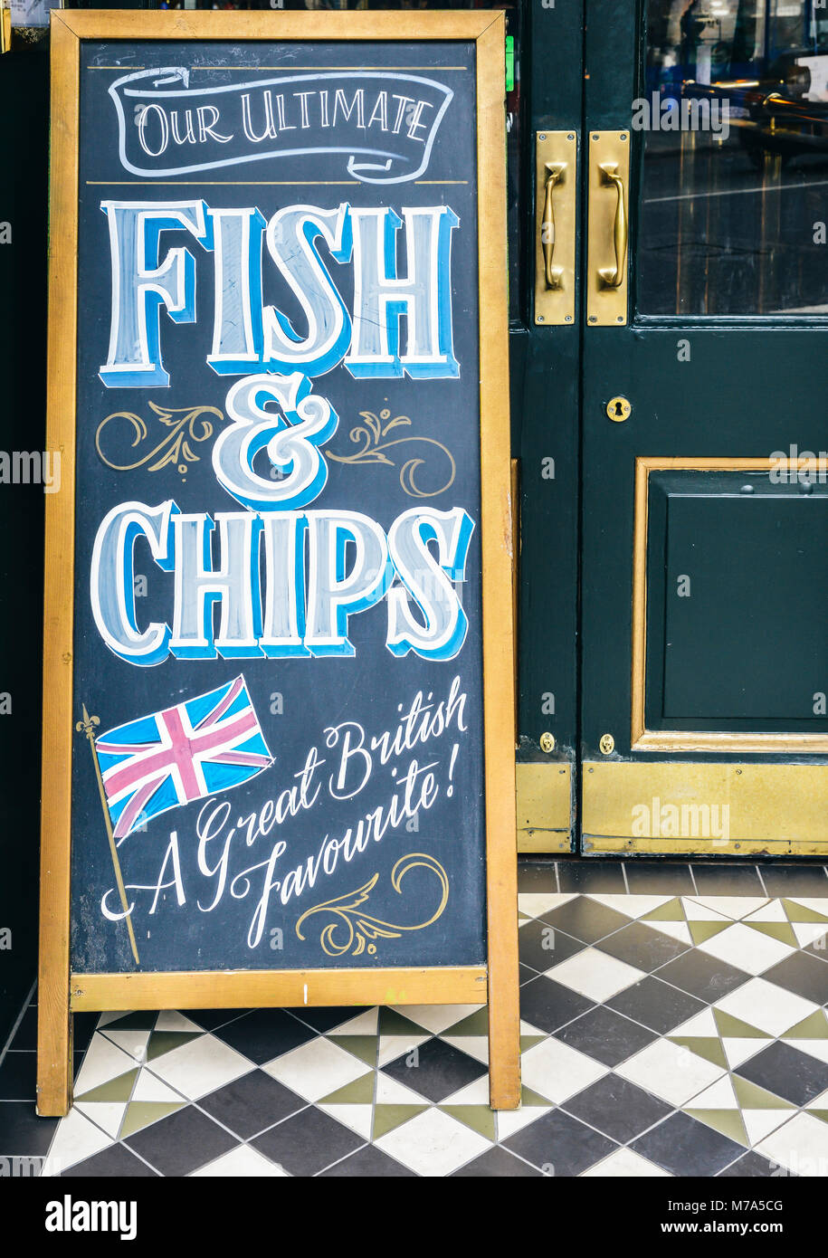 Sign on blackboard outside a pub in London promoting their Ultimate ...