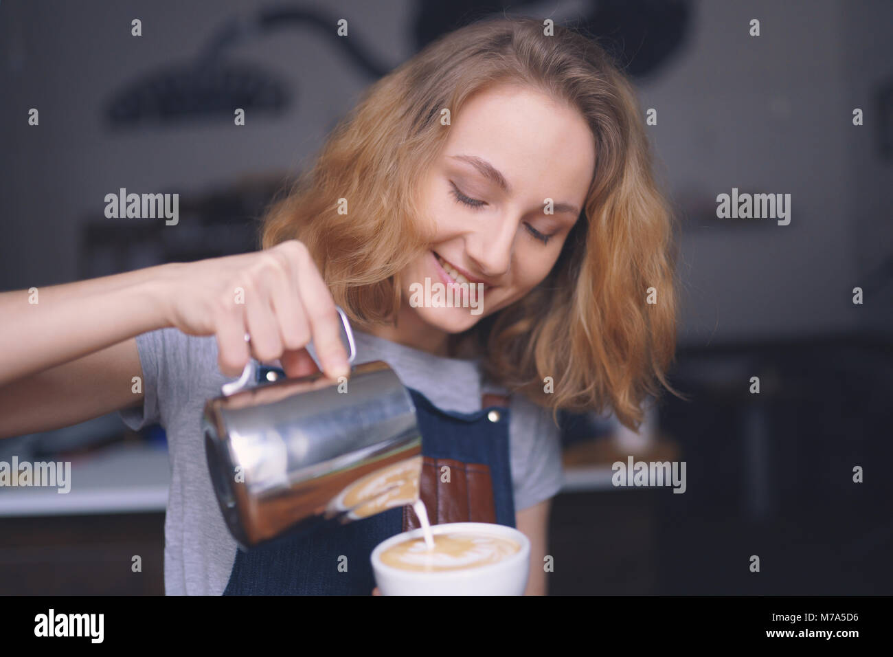 beautiful girl making coffee (cappuccino Stock Photo - Alamy