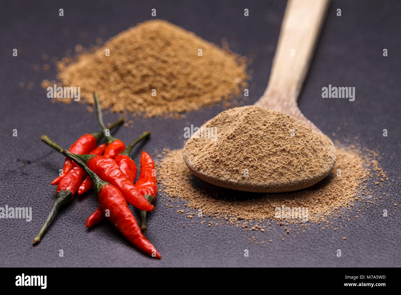 Ground up pure cane sugar and spicy red peppers in concept image. Sugar ...