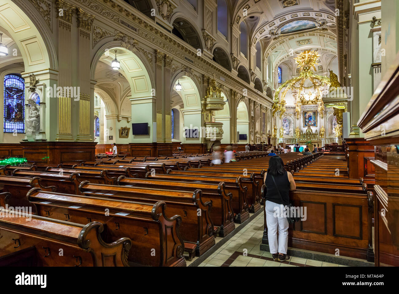 Woman standing at the back of a church interior Stock Photo - Alamy