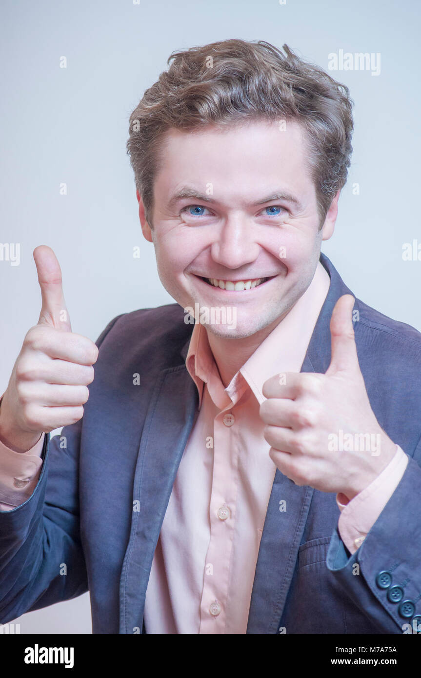 Portrait of young elegant Caucasian Ethnicity happy smiling blue-eyed ...