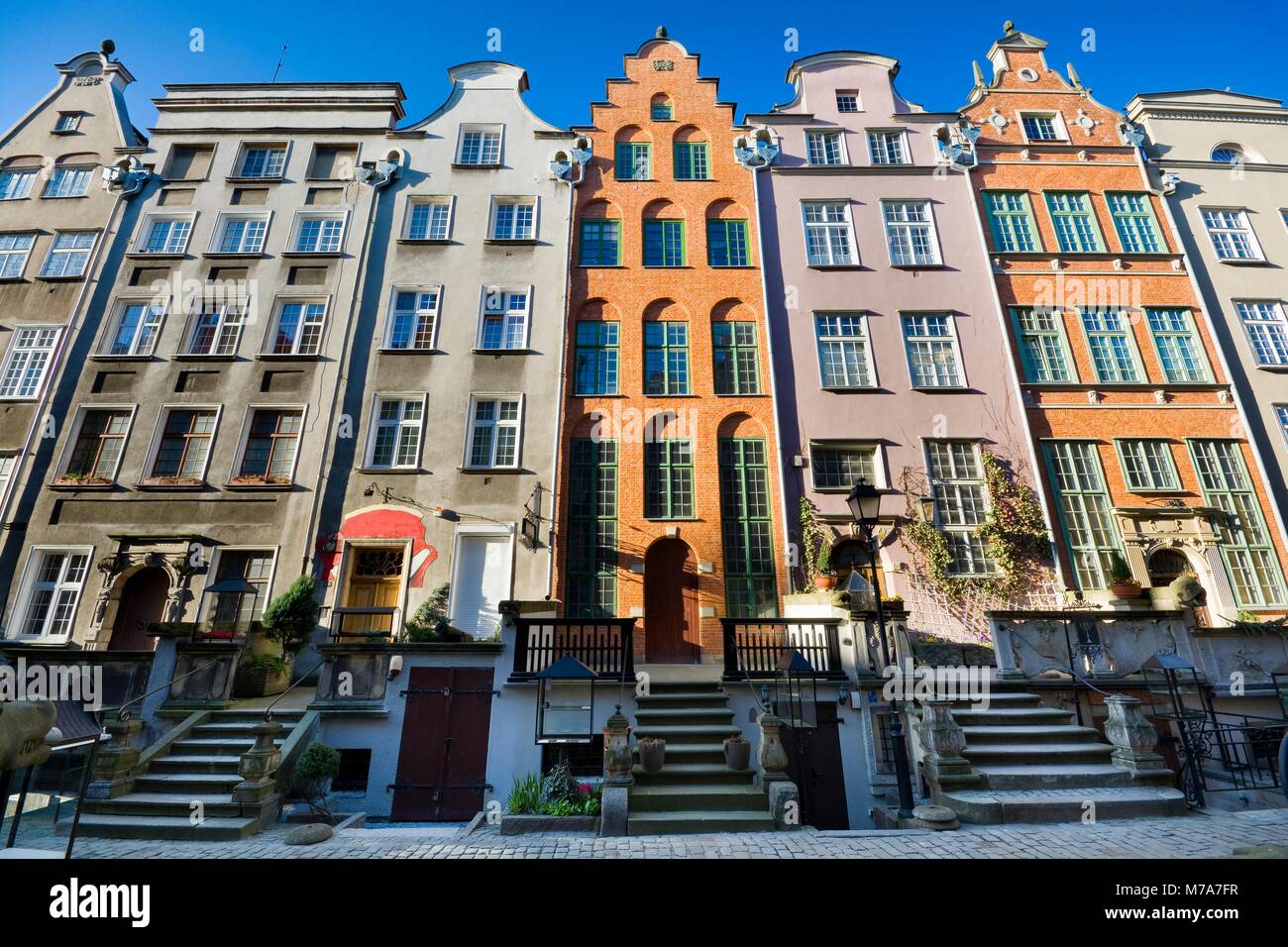 Burgher houses with entrance terraces and richly decorated facades on ...