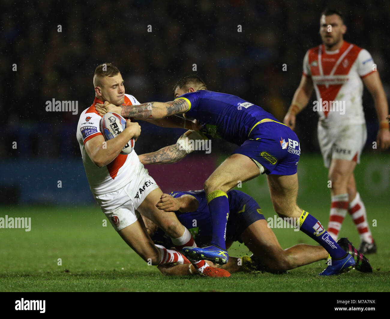 Warrington Wolves Daryl Clark tackles St Helens Matthew Lees during the ...