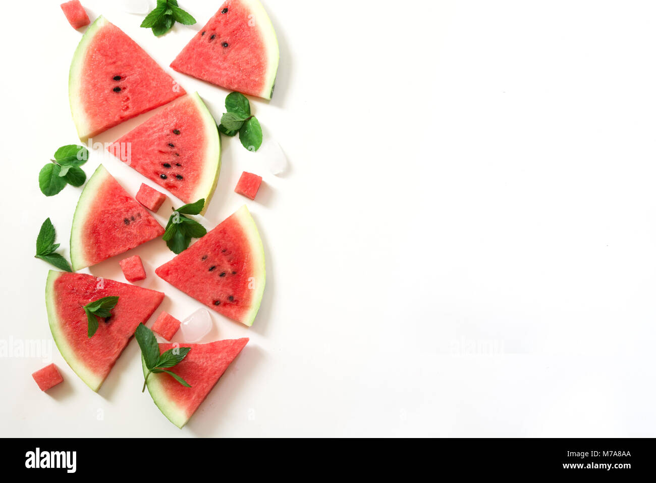 Slice of watermelon, mint ice on a white background Stock Photo - Alamy