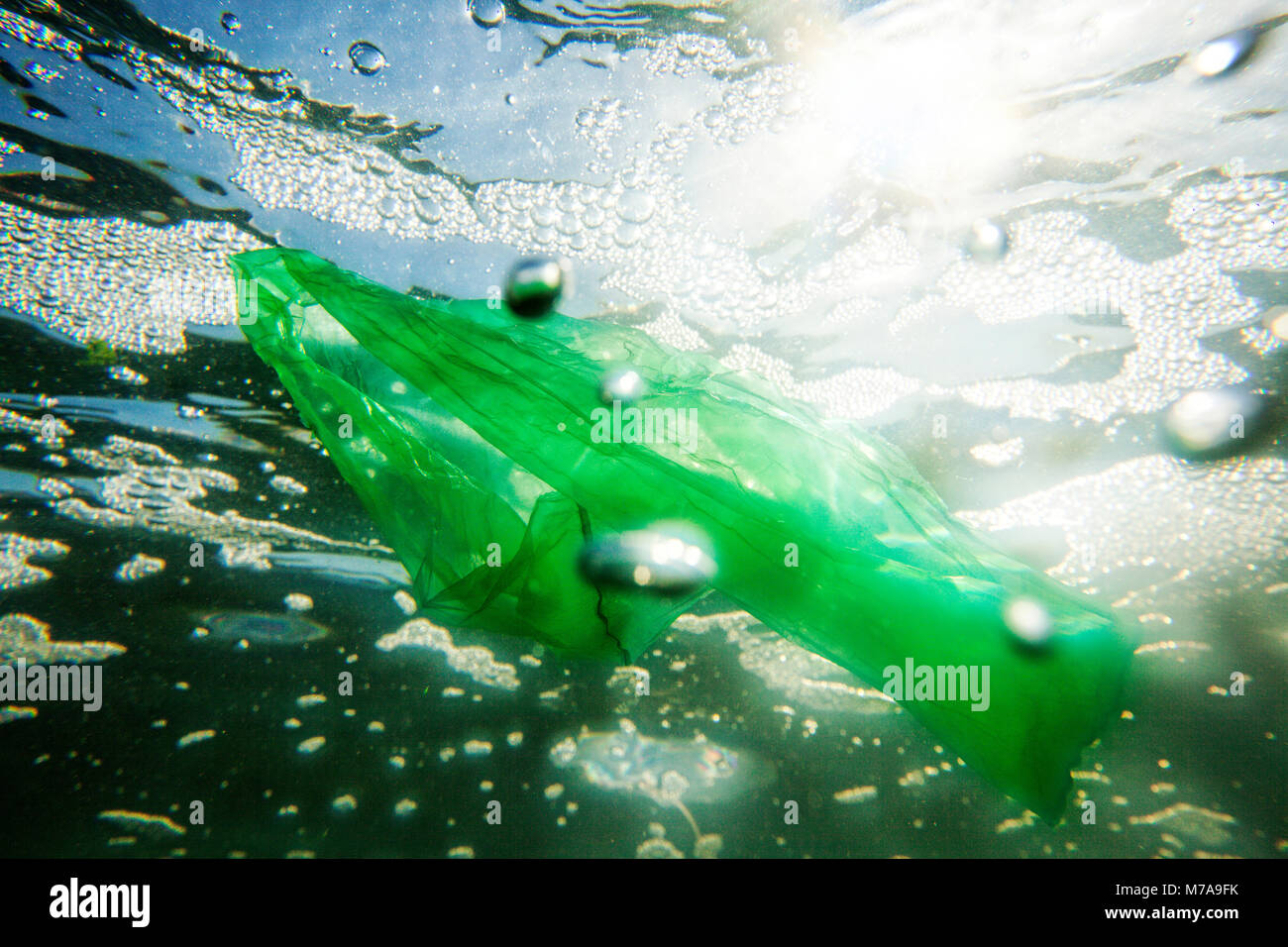 Trash floating on the Brittany shore line,Le Courégant, France. Water ...