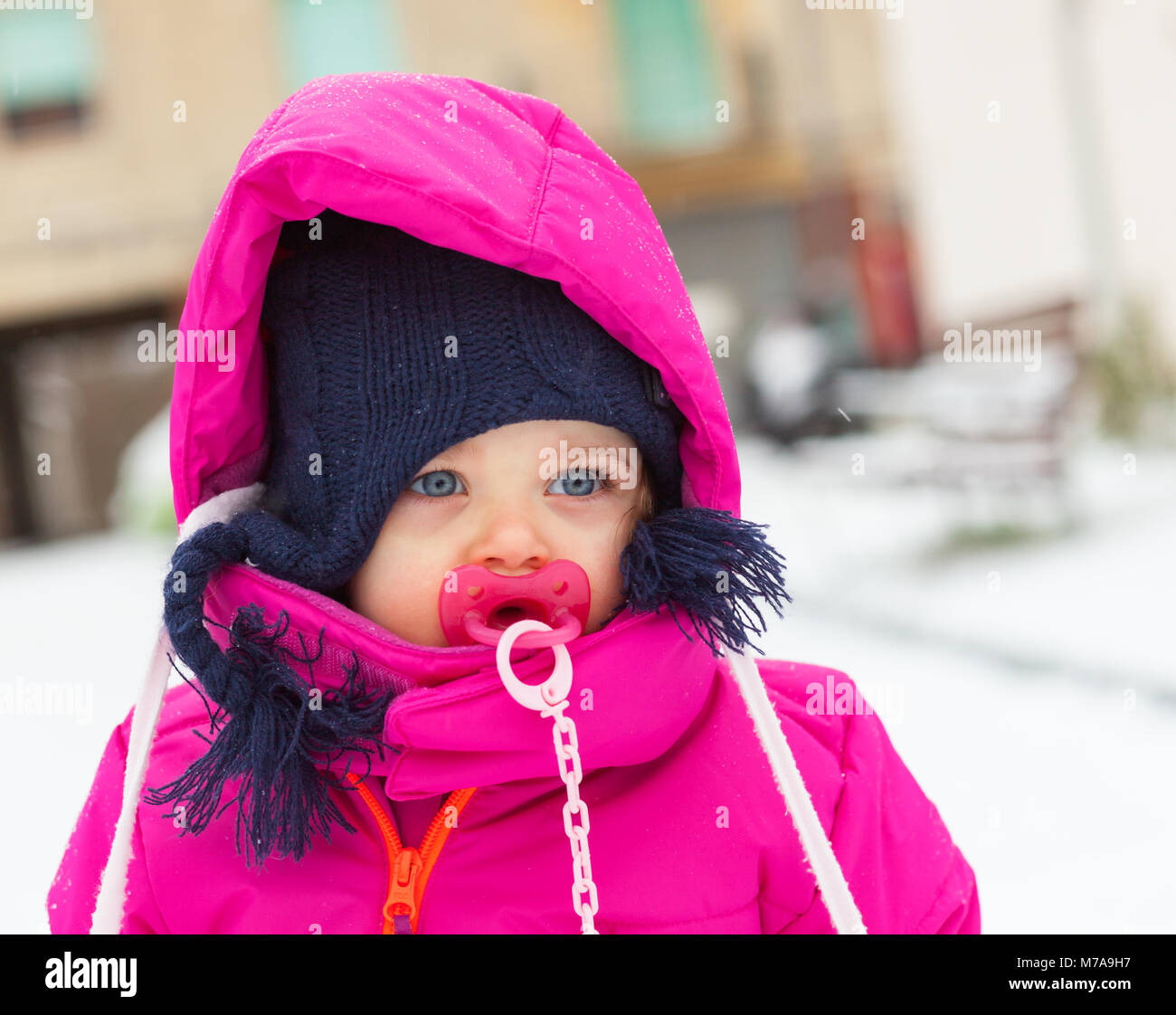 Baby in snowsuit hi-res stock photography and images - Alamy