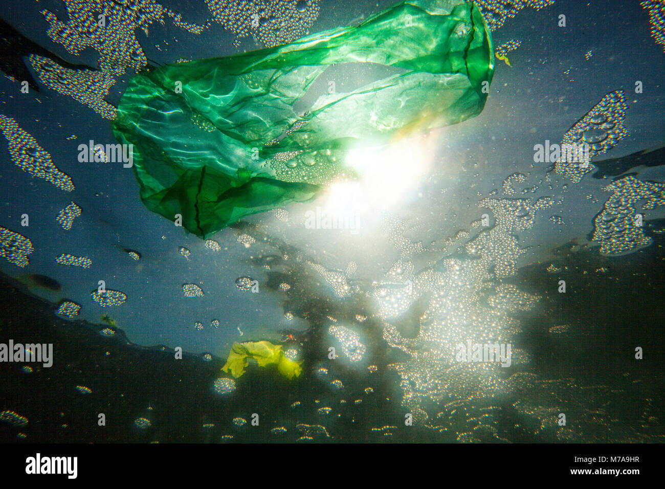 Trash floating on the Brittany shore line,Le Courégant, France. Water ...