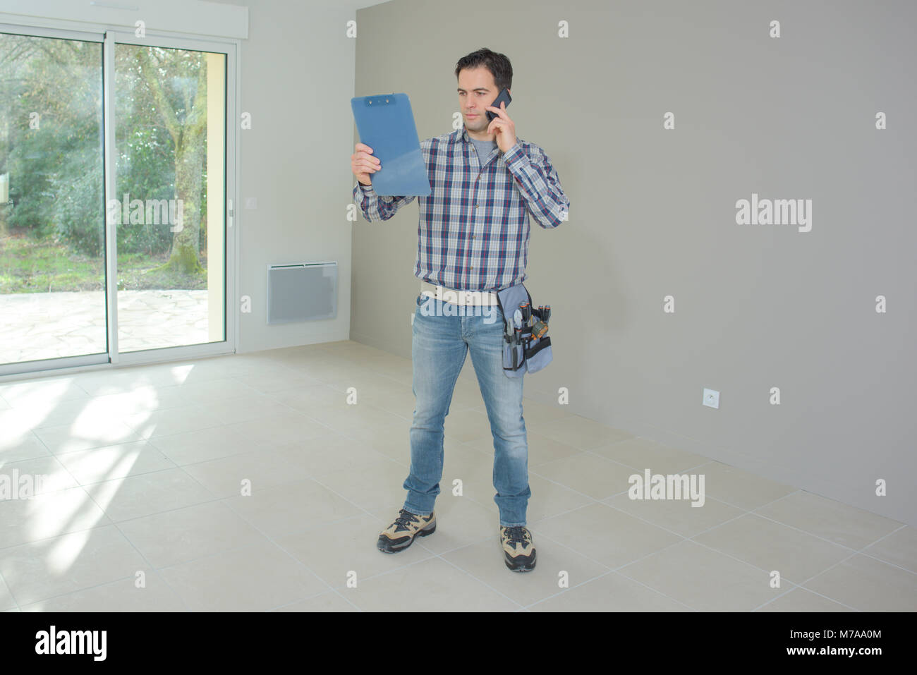 builder happy to have finished the job Stock Photo - Alamy