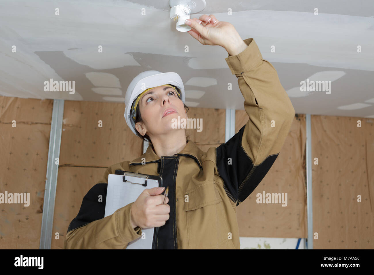 building inspector inspecting the outlet Stock Photo - Alamy
