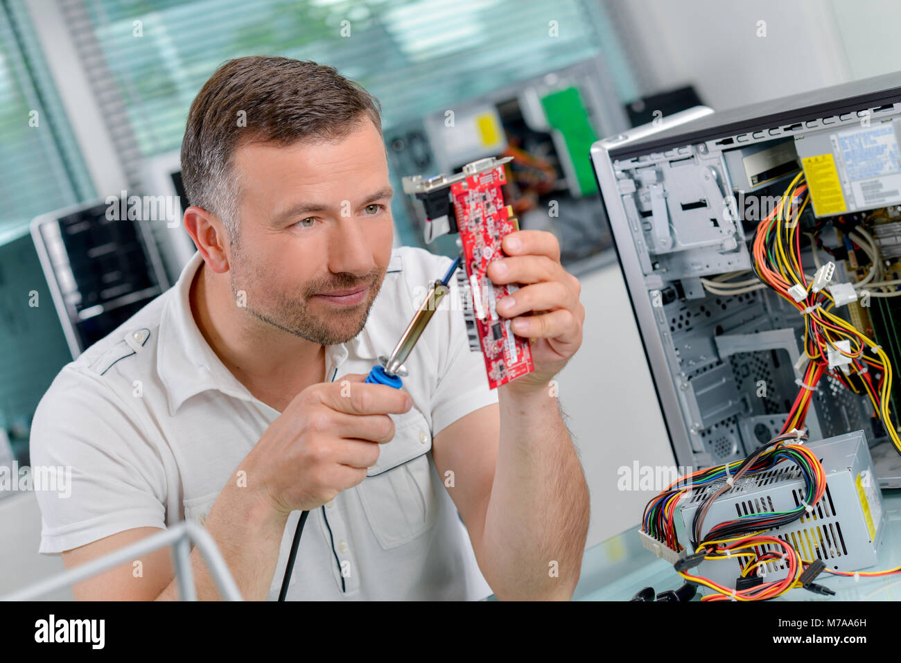 Engineer repairing a PC Stock Photo - Alamy