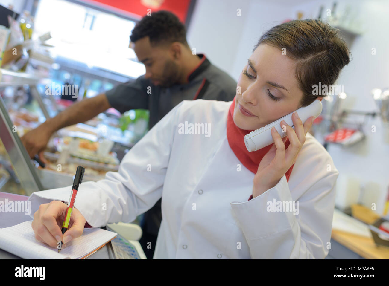 Female chef taking telephone order Stock Photo - Alamy
