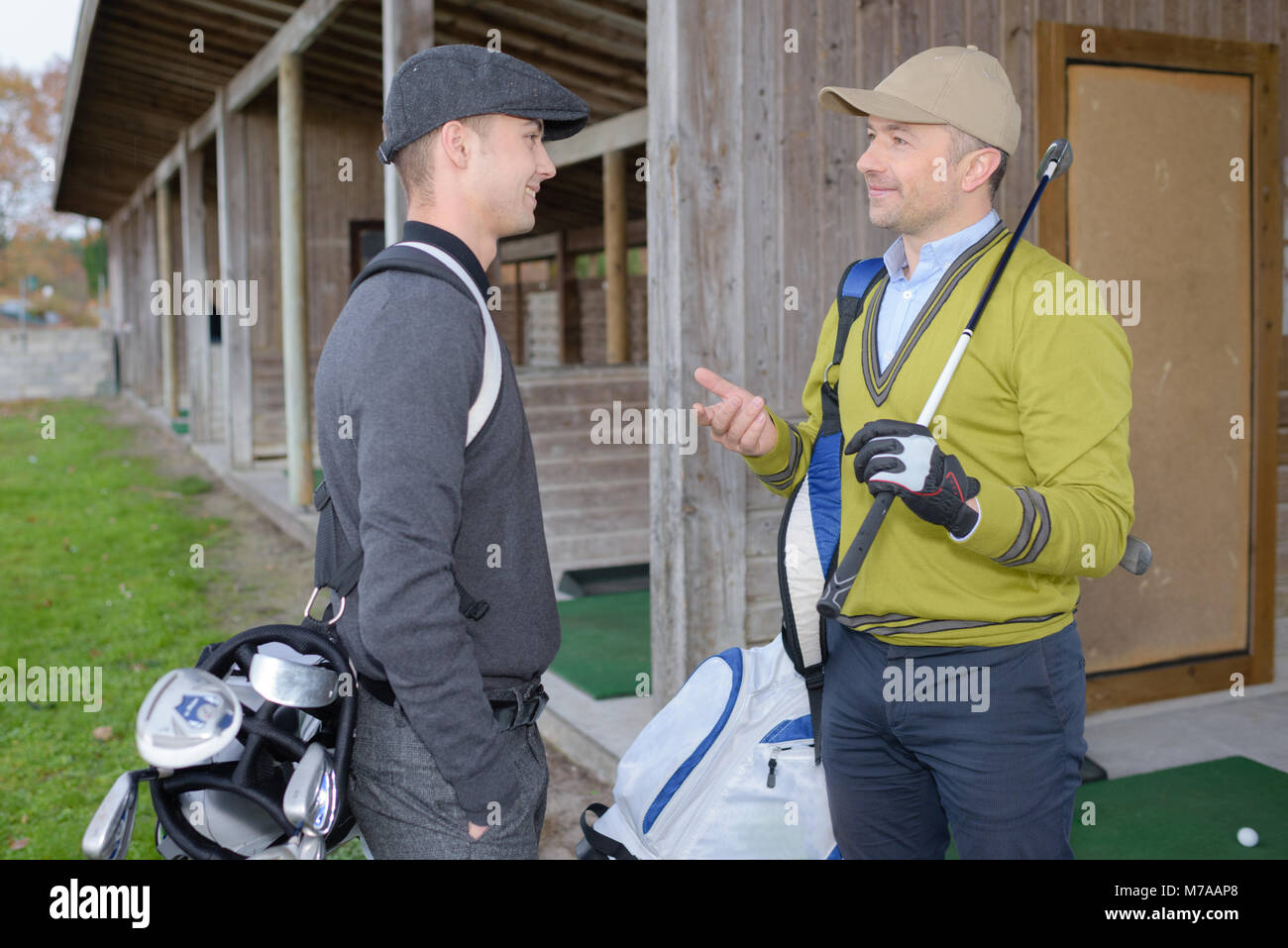 conversation before golf practice Stock Photo - Alamy