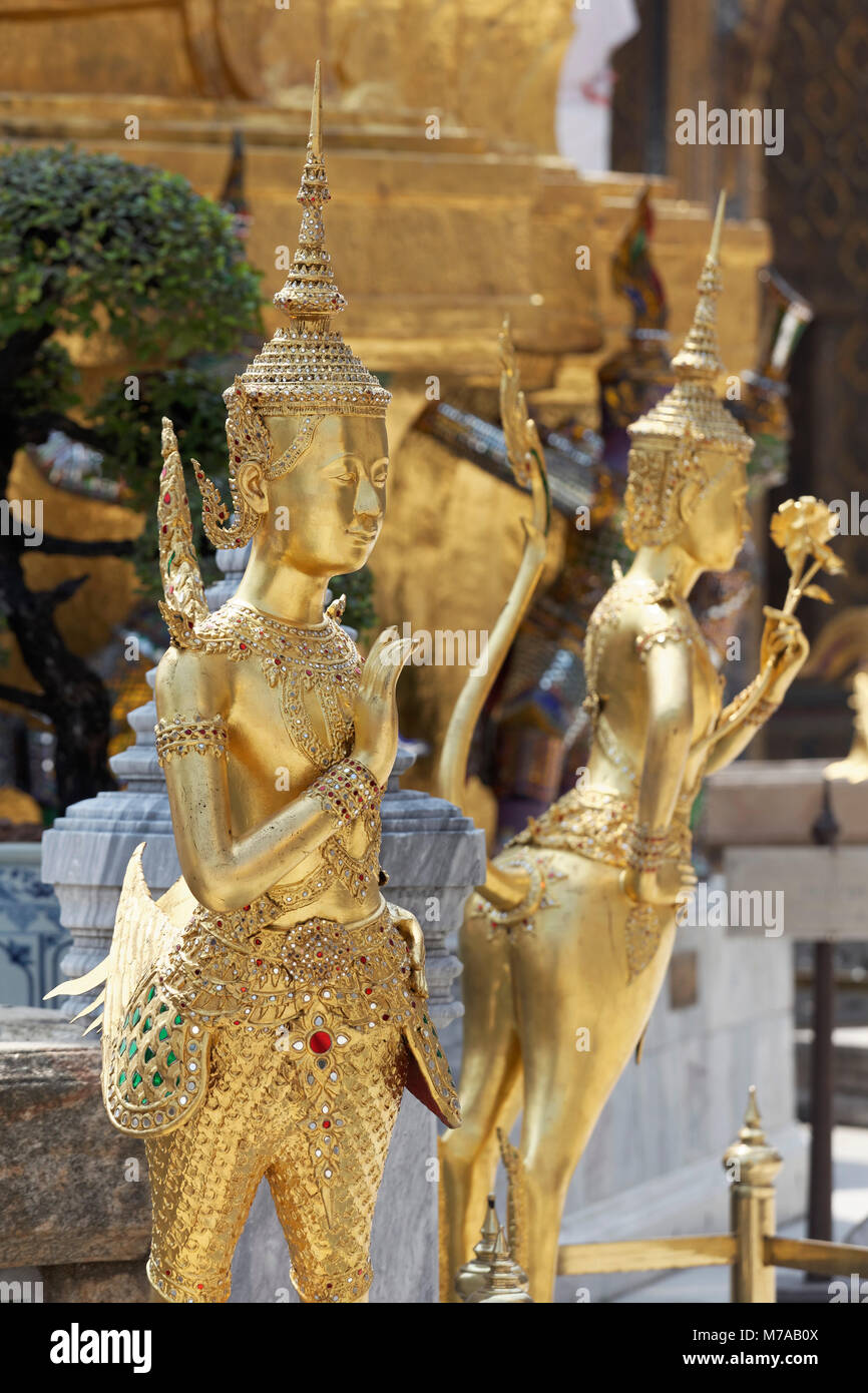 Gilded statues, mythical Buddhist figures, in front Theppaksi, half ...