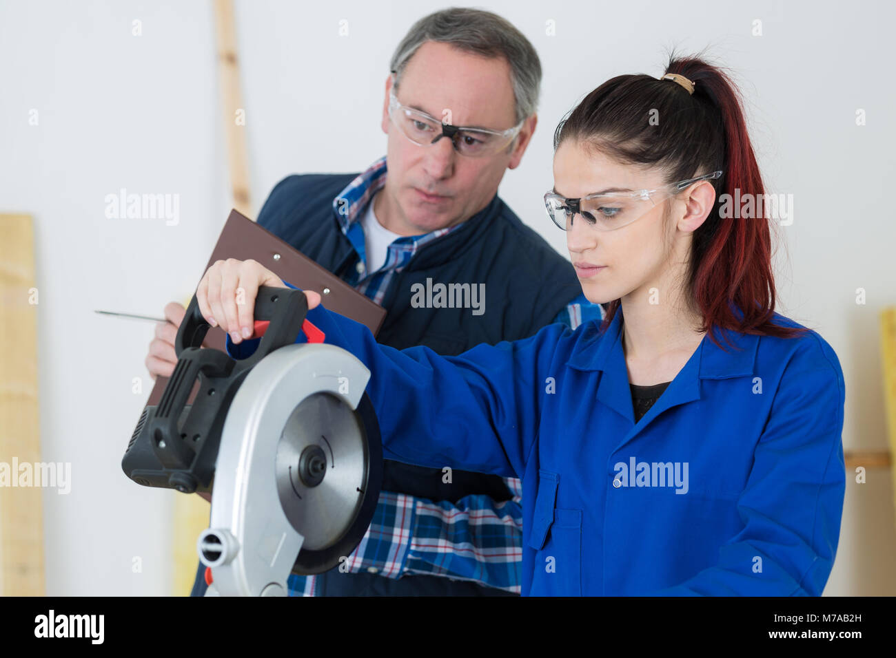 apprentice using a circular saw Stock Photo - Alamy