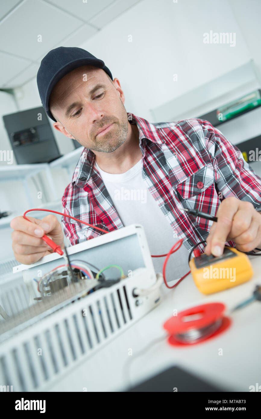 Electrician testing appliance multimeter hi-res stock photography and ...