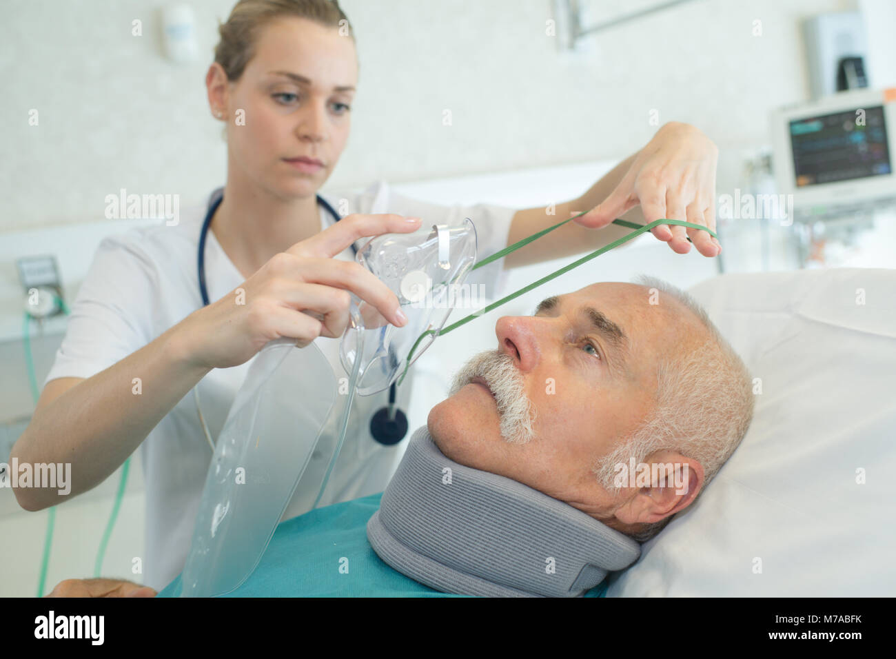 doctor putting oxygen mask on a senior patient Stock Photo - Alamy