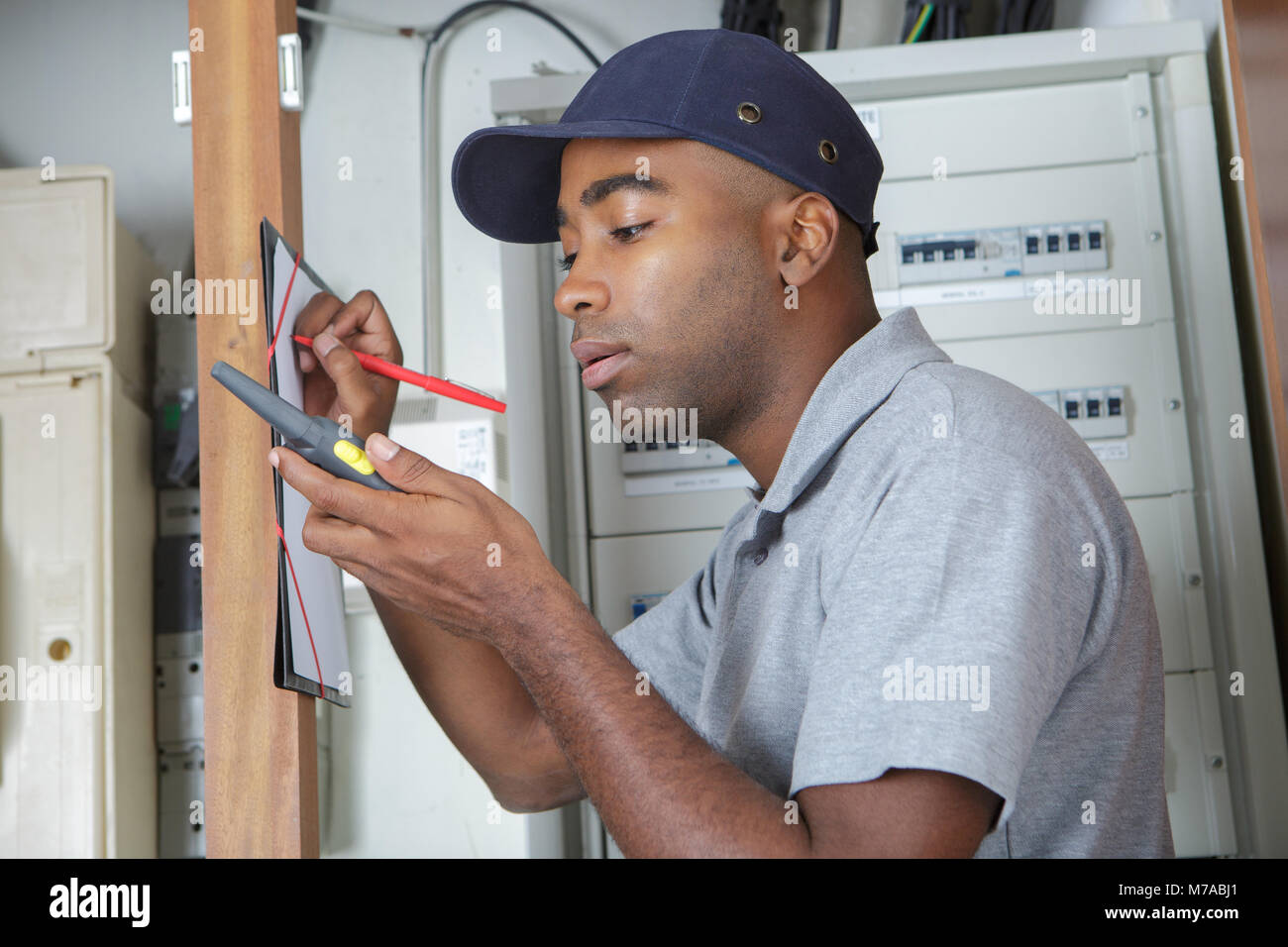 Electrician with walkie talkie Stock Photo - Alamy
